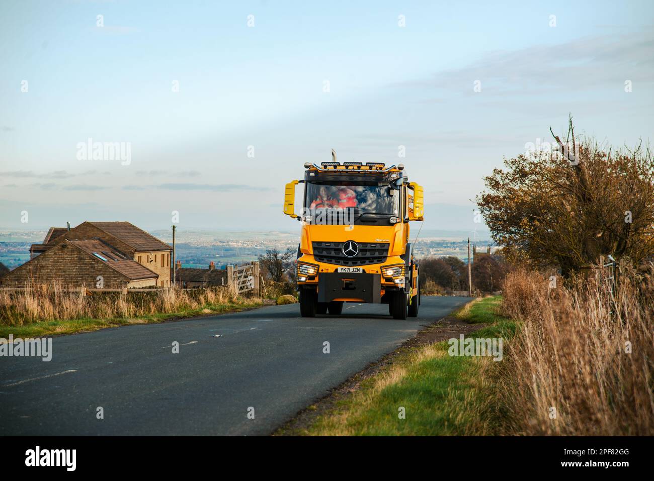 Mercedes Benz Arocs gritter truck operating on the roads of West ...