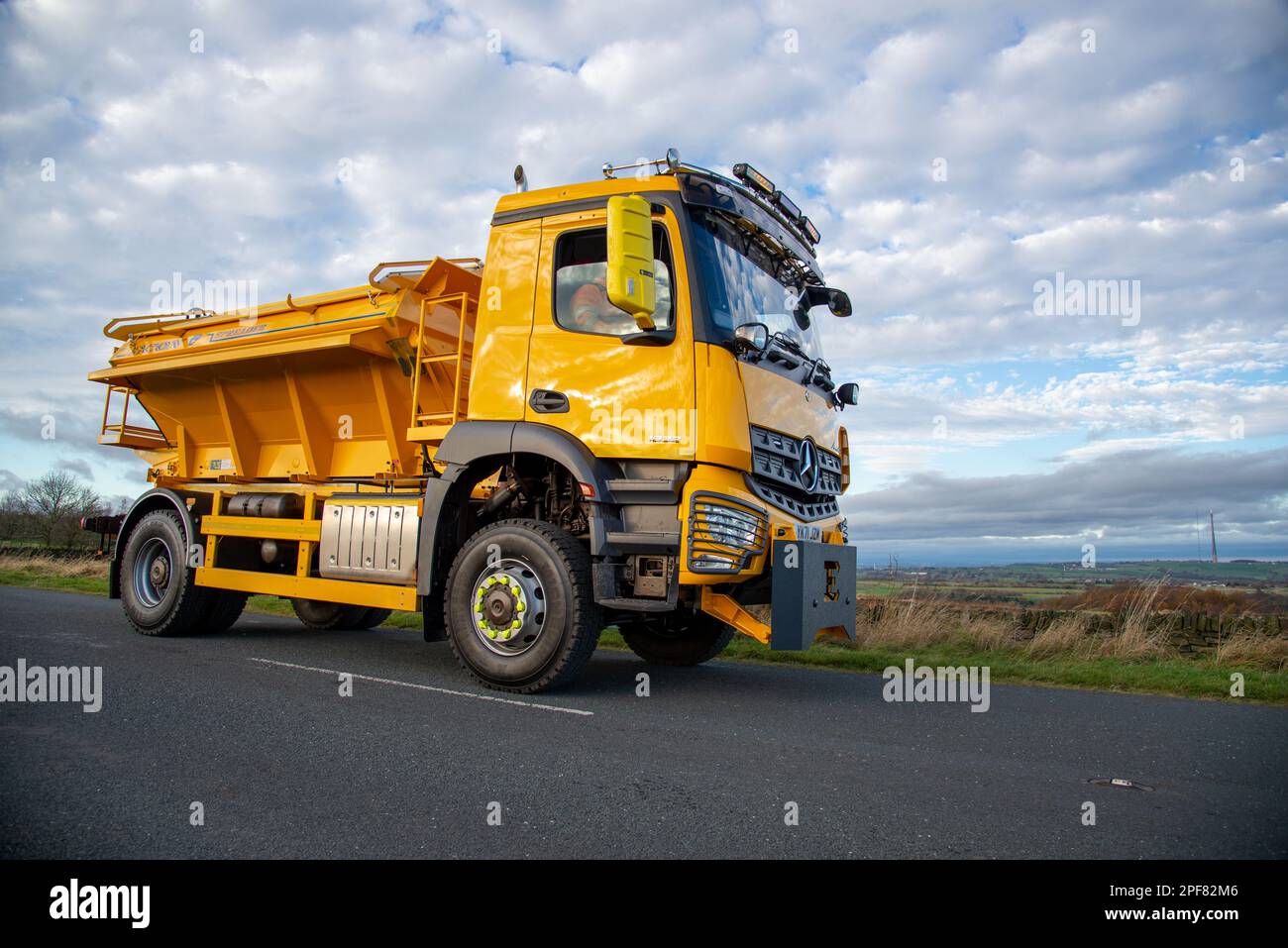 Mercedes Benz Arocs gritter truck operating on the roads of West ...