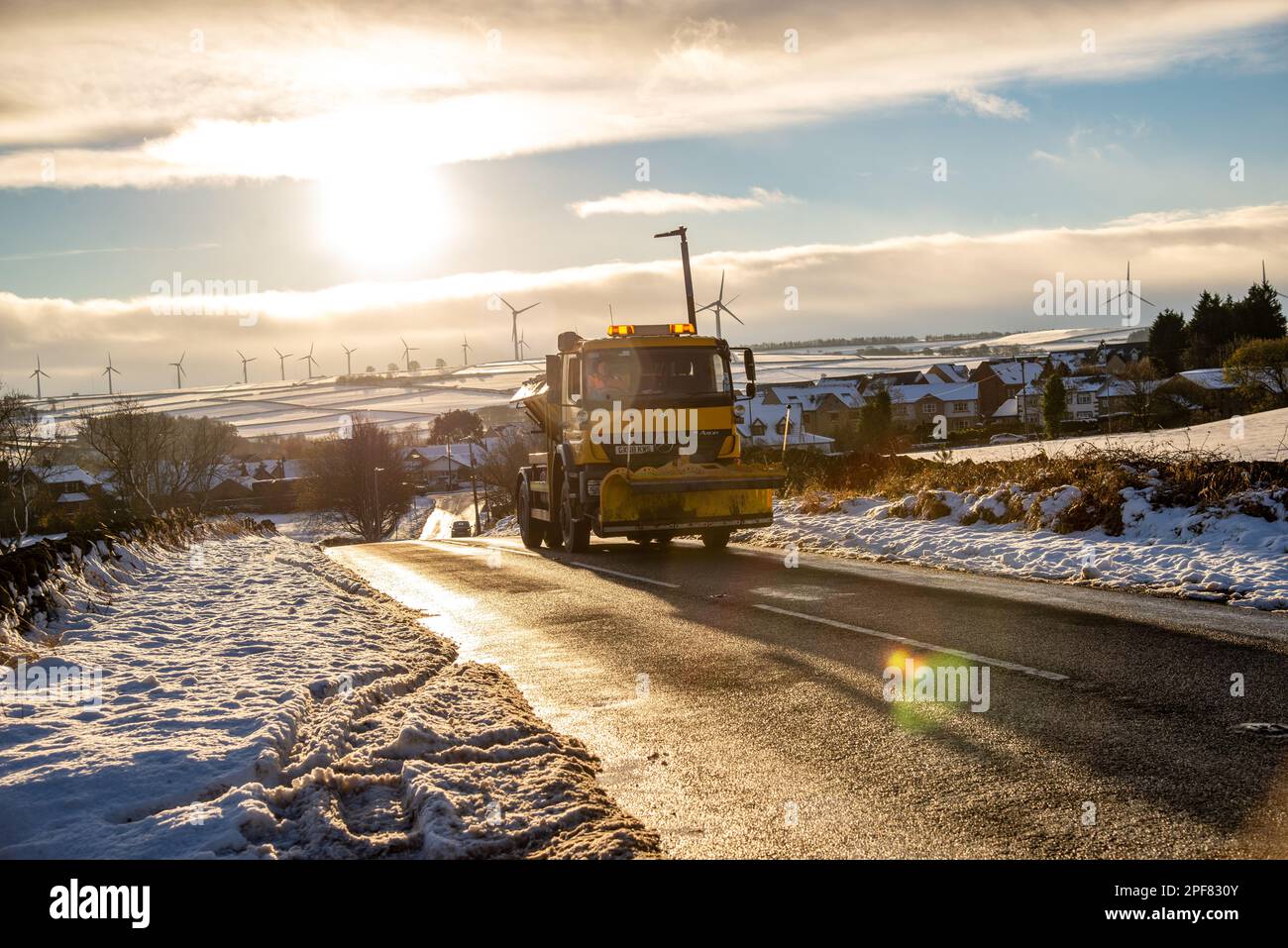 Mercedes Benz Arocs snow plough and gritter truck operating on the ...