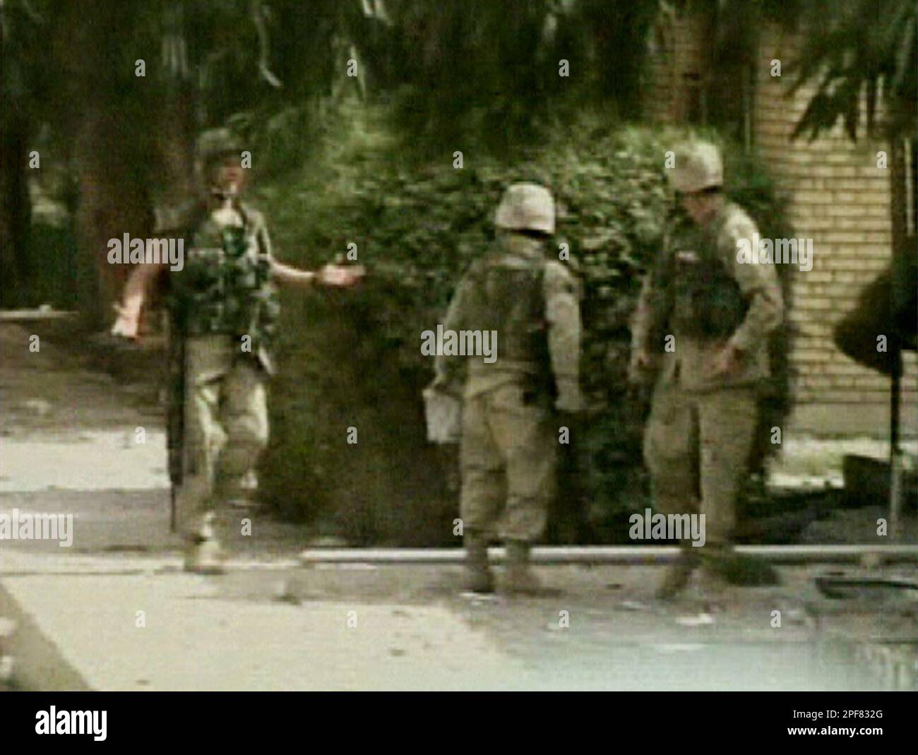 Soldiers, seen in this image from video, Saturday, April 5, 2003 ...