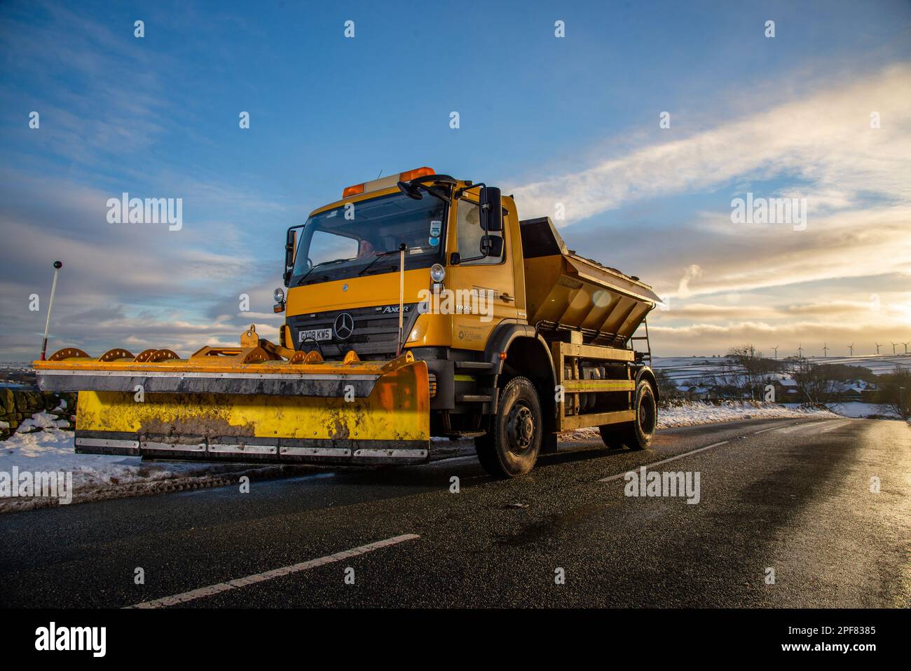 Mercedes Benz Arocs snow plough and gritter truck operating on the ...