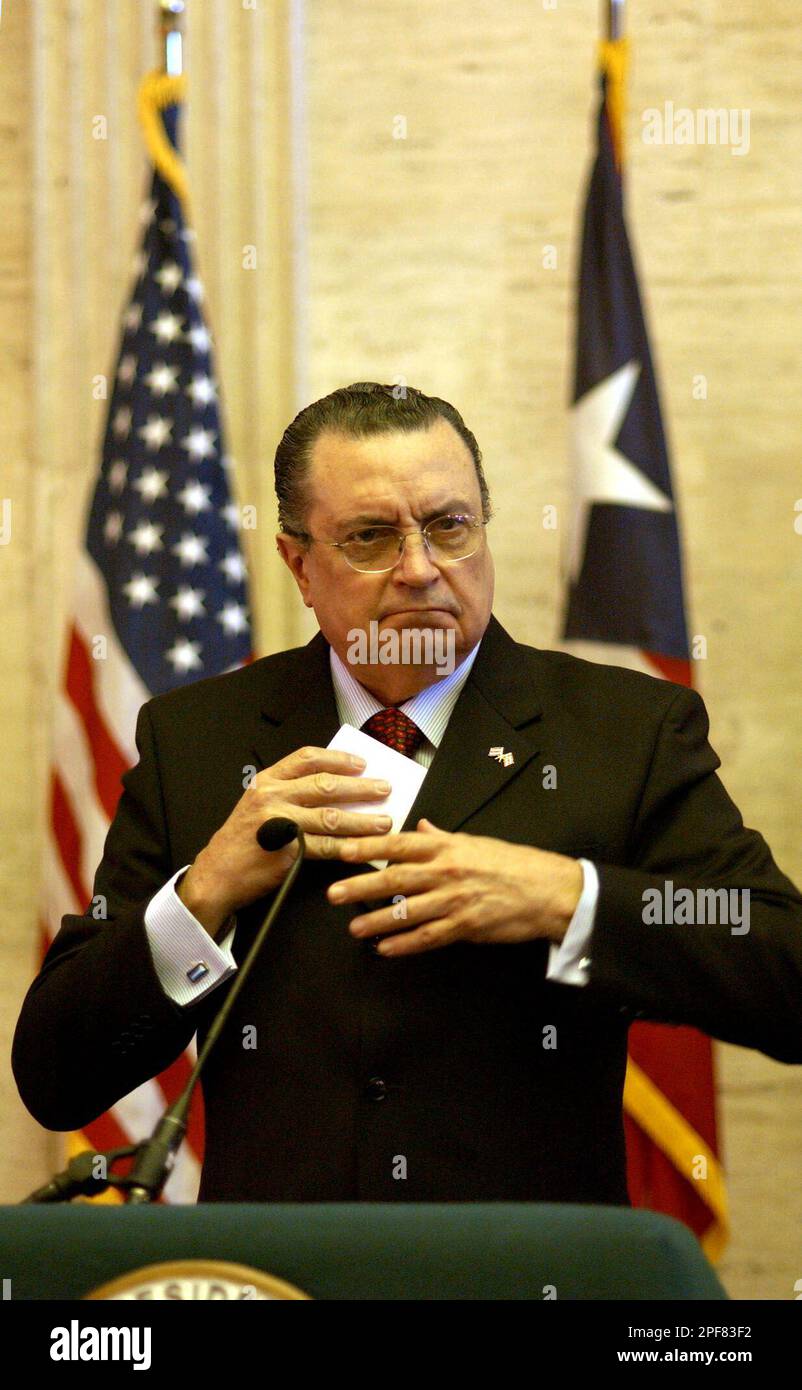 Costa Rican President Abel Pacheco takes out his speach notes before ...