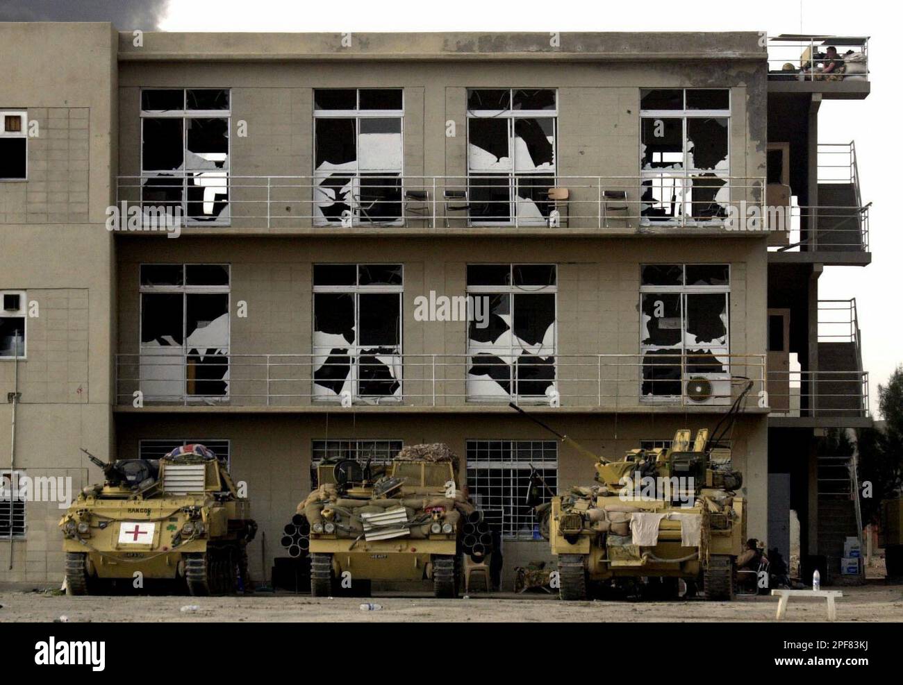 Vehicles of the British Desert Rats are parked at an operational post ...