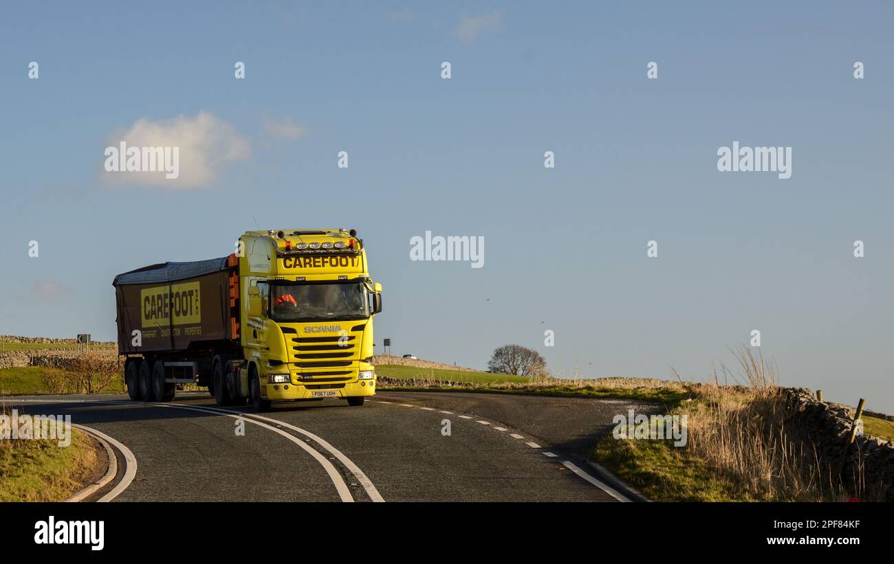 Volvo bulk tipper on the A623, a rural A-road in the Peak District in ...