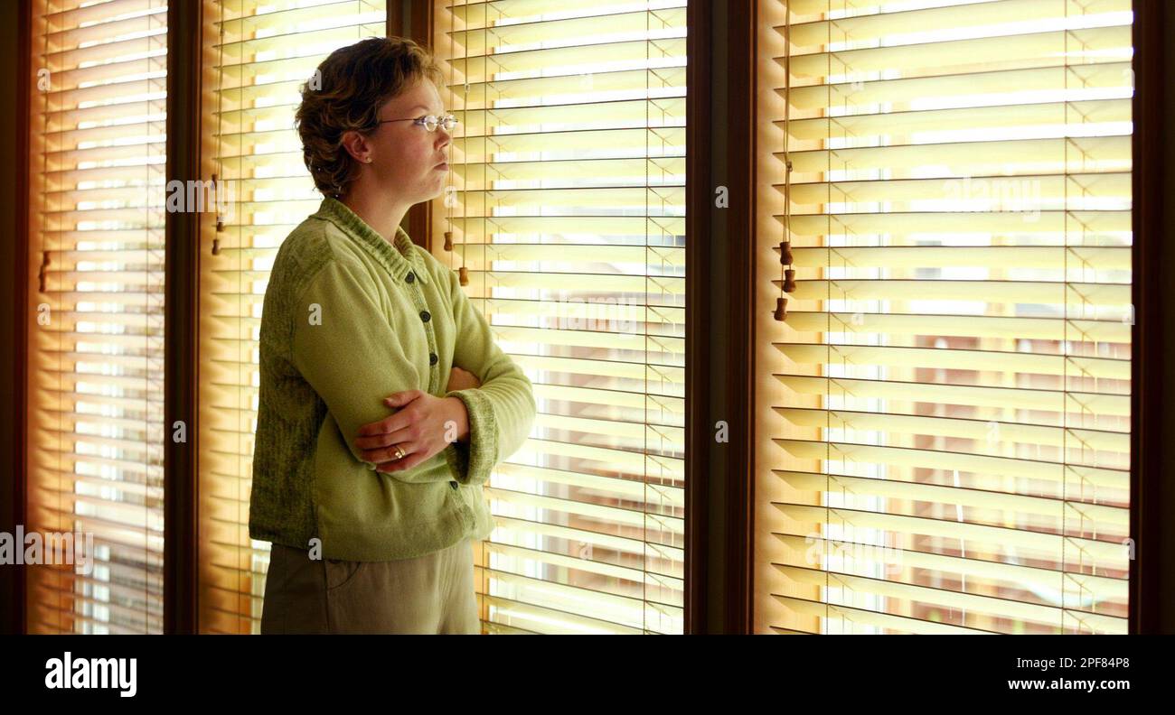 Lisa Hawash looks out a window in her family home in Hillsboro, Ore ...