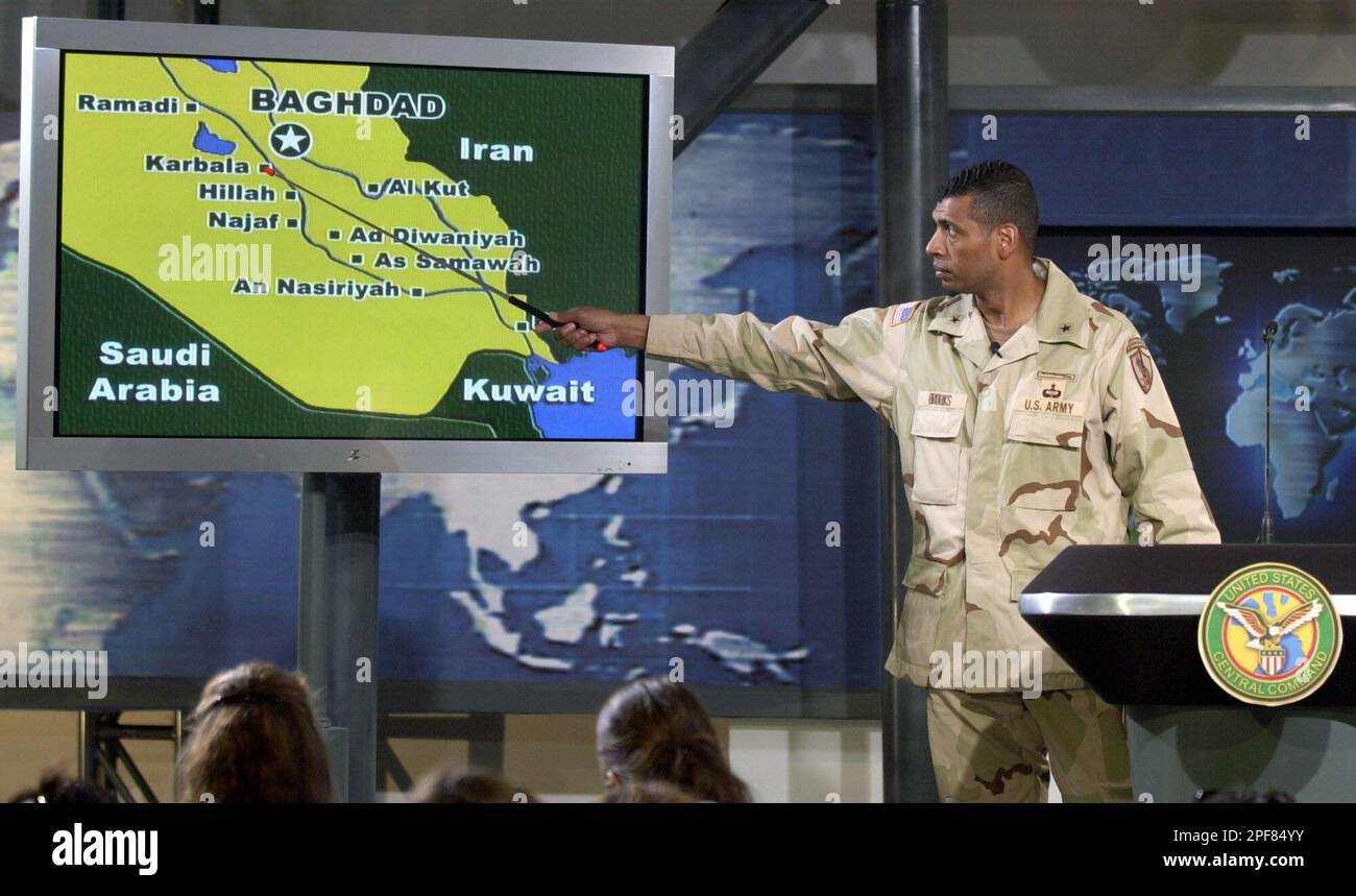 United States Brigadier General Vincent Brooks, uses a pointer to show ...