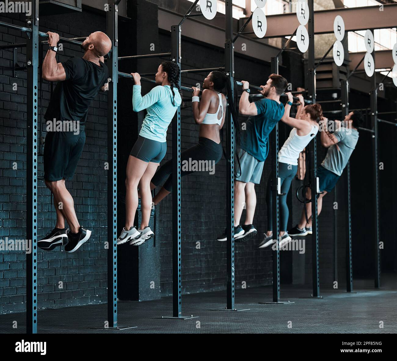 Strong arms wont build themselves. a group of people completing pull ...