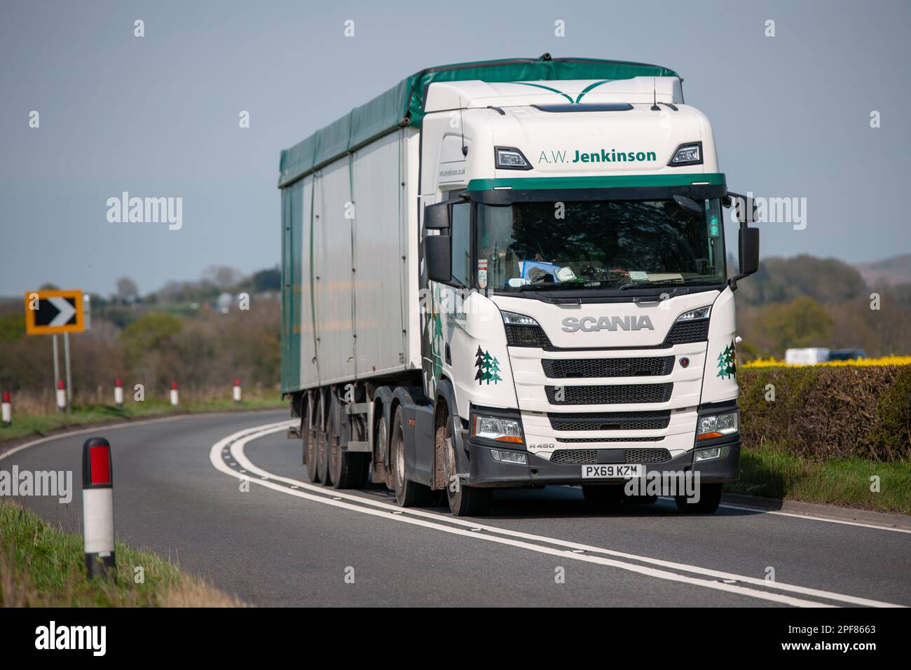A. W. Jenkinson forest and timber products truck rounding a corner on a ...