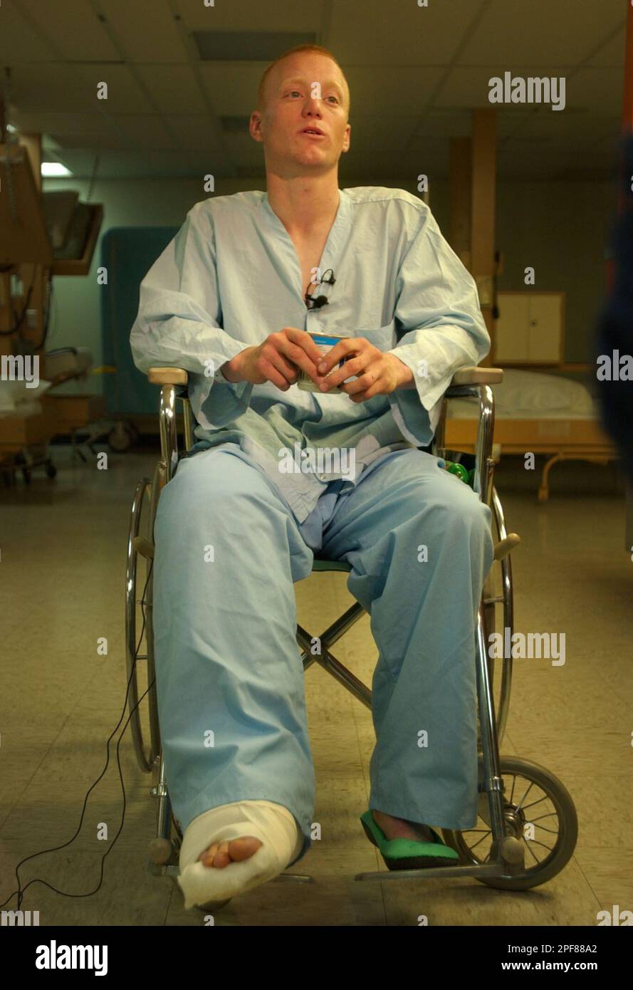 U.S. Marine Cpl. Michael Mead of Newberry, MI, talks to the media ...