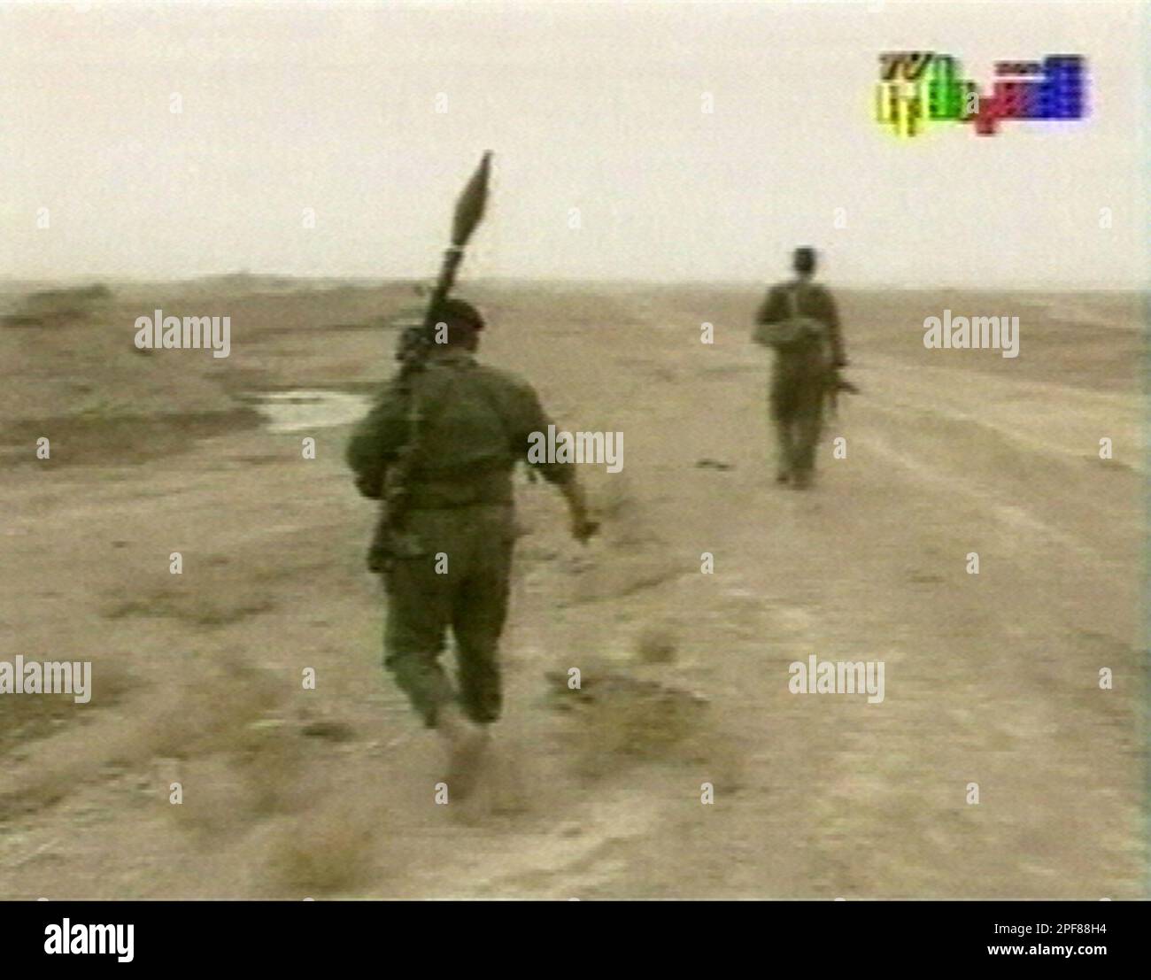 An Iraqi soldier carries an RPG, Rocket Propelled Grenade, launcher in ...