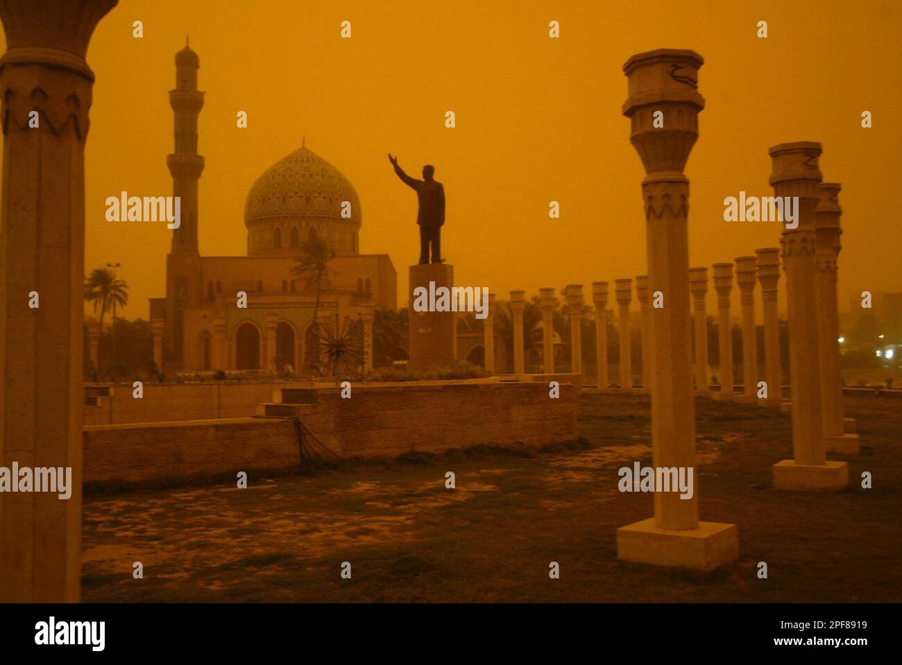 A statue of Iraqi President Saddam Hussein stands in the middle of an ...