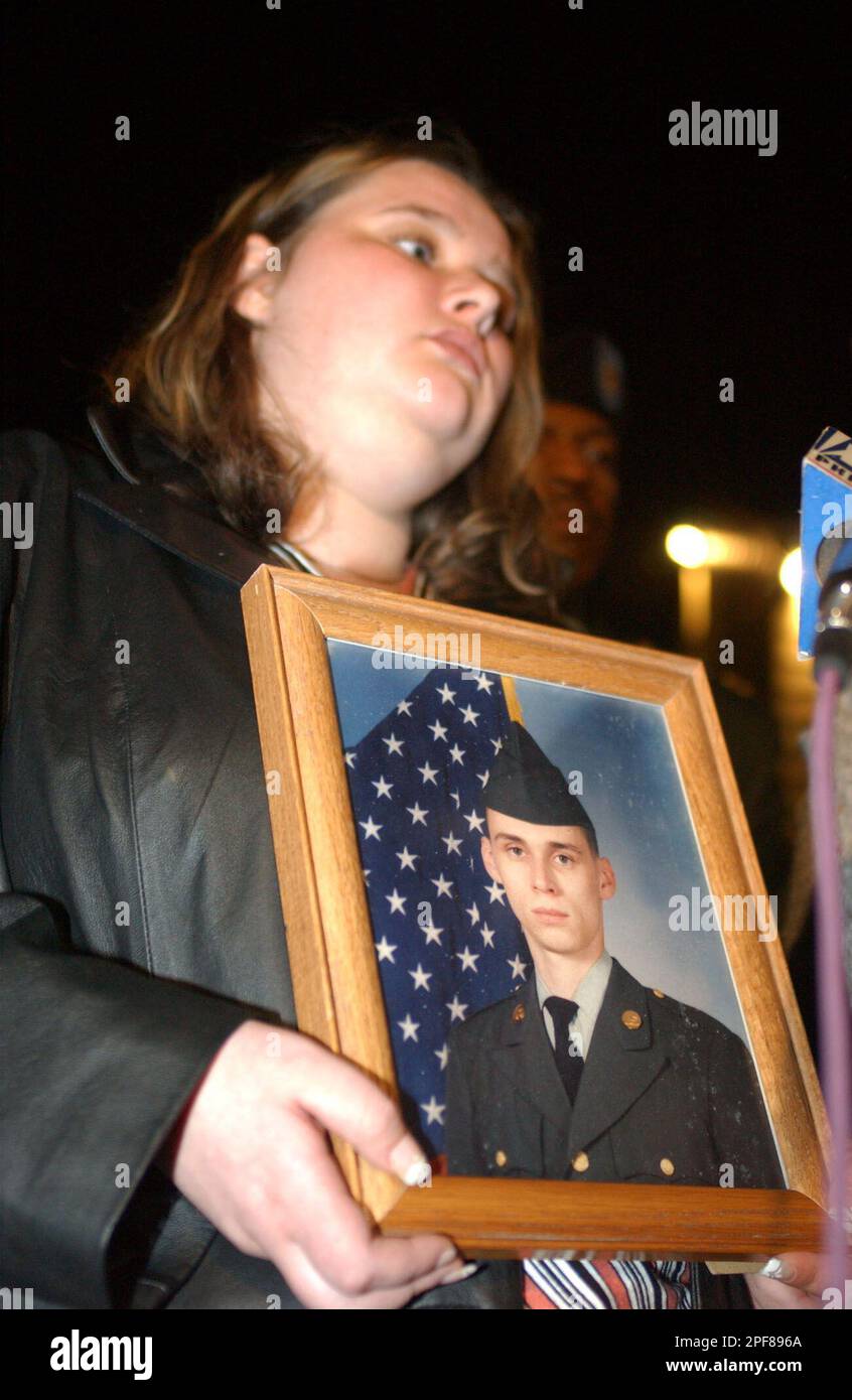 Katherine Riley, 22, holds a picture of her brother, Army Sgt. James ...