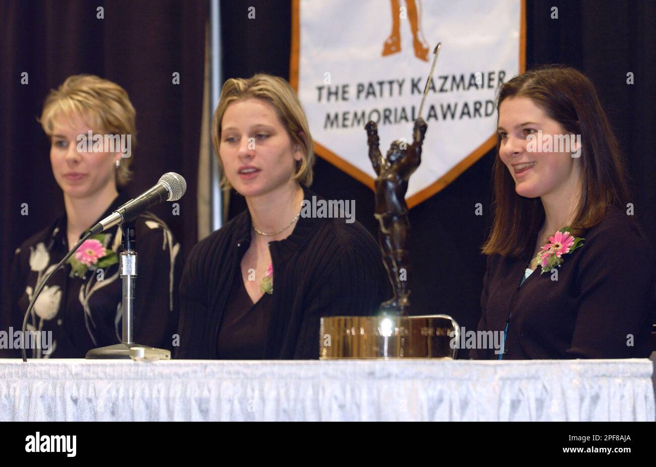 Harvard senior forward Jennifer Botterill, right, smiles after being ...