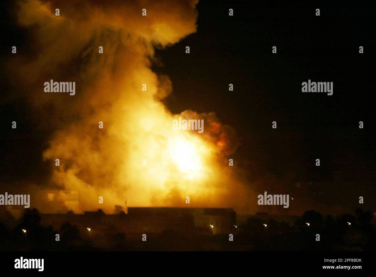 A government building burns during heavy bombardement of Baghdad, Iraq ...