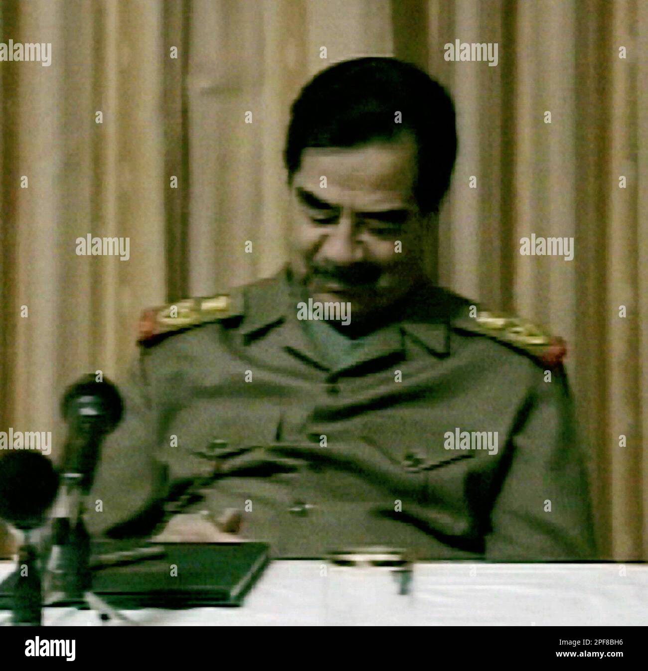 Saddam Hussein, seen in this image from video broadcast on Iraqi ...