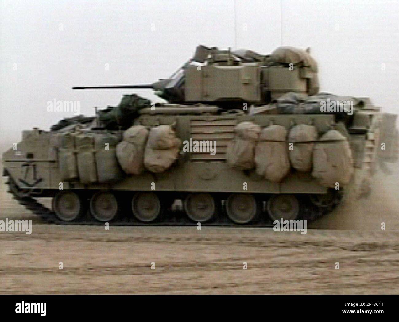 In this image from television, a U.S military vehicle from the 3rd ...