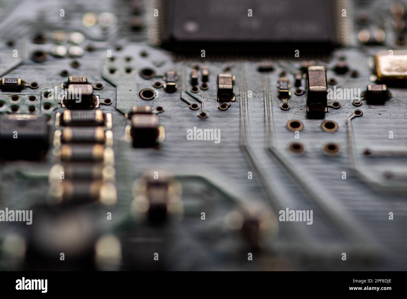 closeup of a circuit board from a hard drive with transistors Stock ...