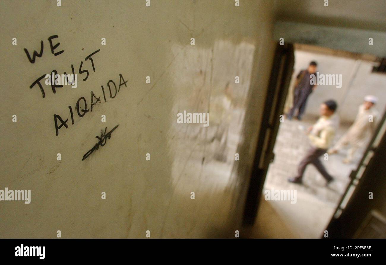 Pro-al-Qaida graffiti adorns a wall in an office building just off ...