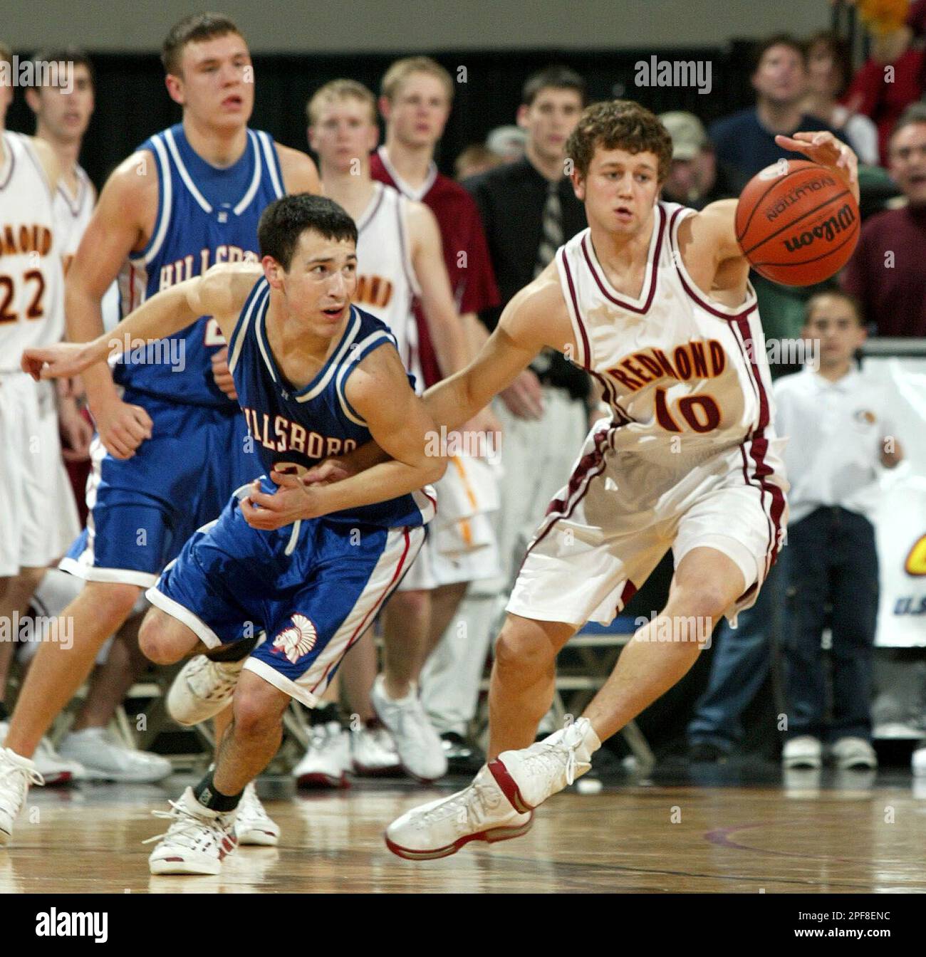 Hillsboro's Tomas Mosqueda, left, and Redmond's Matt Hilgers (10) both ...