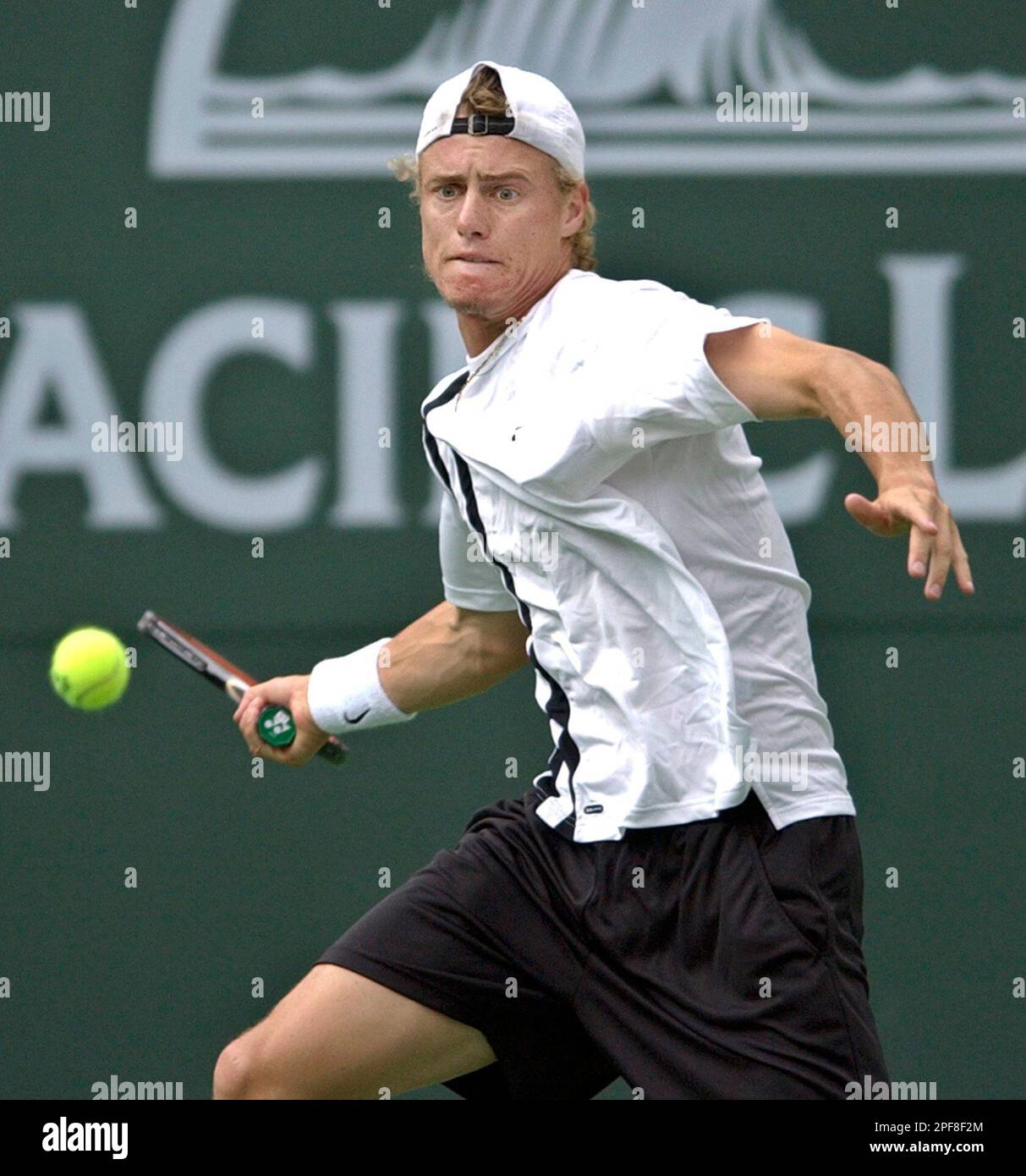 Top-seeded Lleyton Hewitt of Australia returns a shot to Vincent Spadea ...