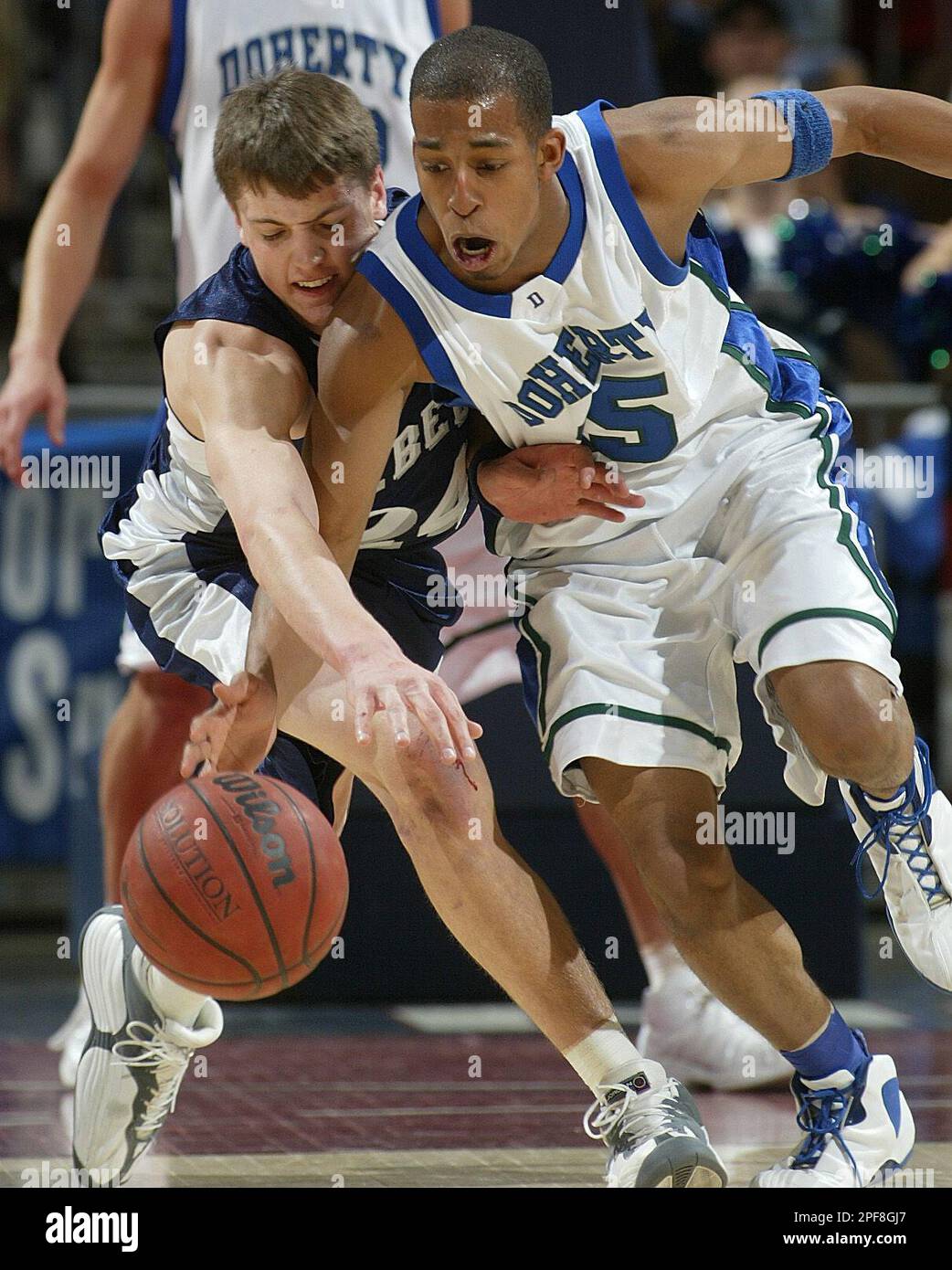 Columbine's Dan Hahn, left, and Doherty's Brandon Dyett, right, chase a ...