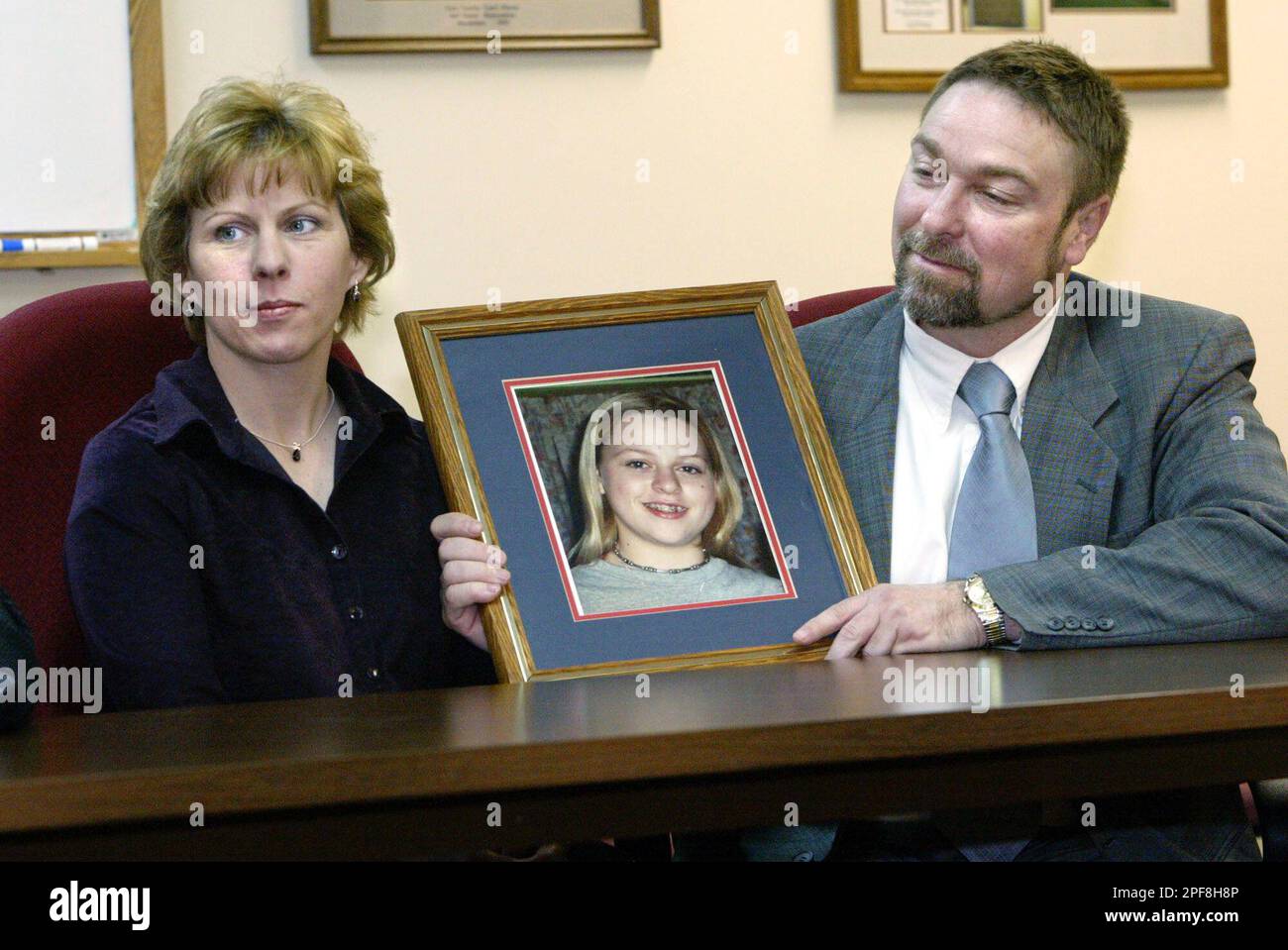 Carol and Patrick Ryan hold a portrait of their daughter Lindsey Ryan ...