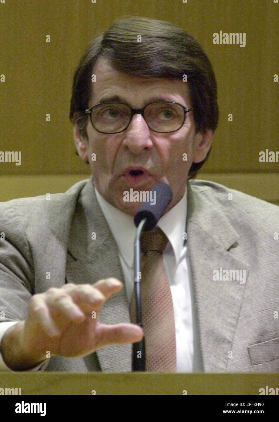 Alan Mackerley gestures as he takes the stand in his own defense during ...