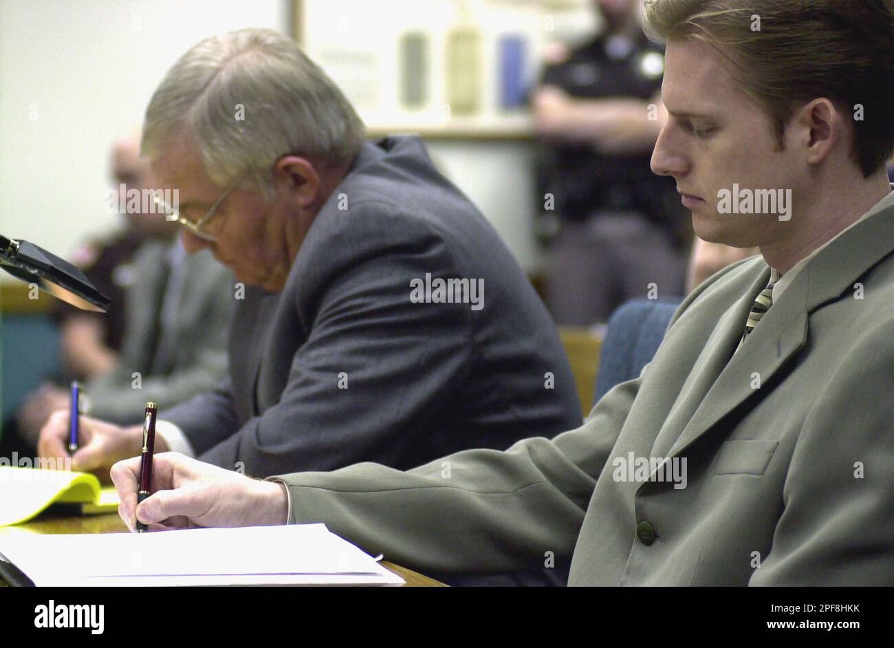 Christian Longo, right, sits with with defense attorney, Ken Hadley, at ...