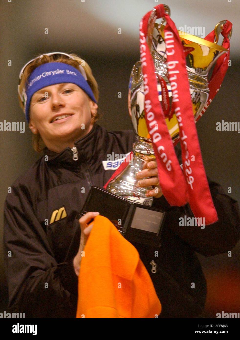 Germany's Monique Garbrecht holds the trophy after she won the 1,000 ...