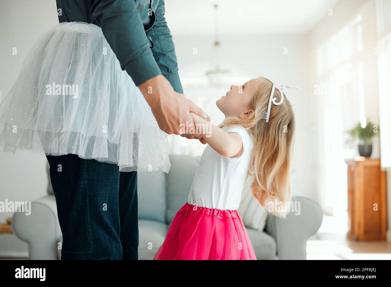 Teaching Daddy how to dance. an adorable little girl wearing a tutu and ...