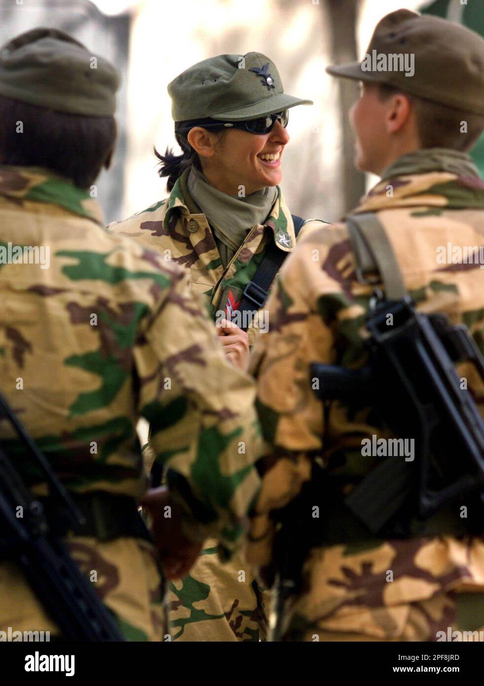 Italian Army Corporal Paola reacts as she talks to Italian personnel at ...