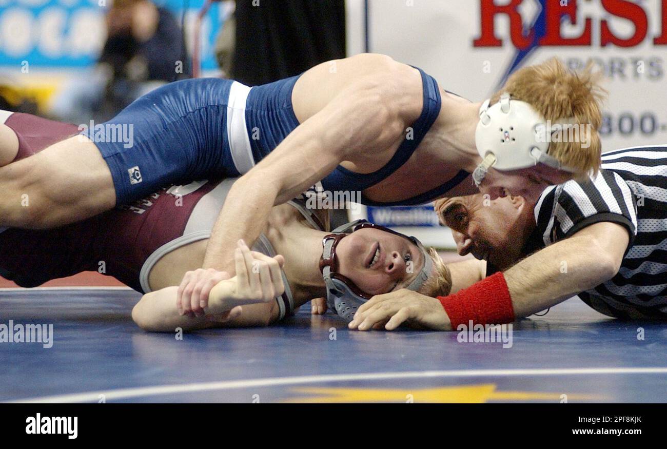 Cedar Crest's Tim Haas, top, wrestles with State College's Chris Decker ...