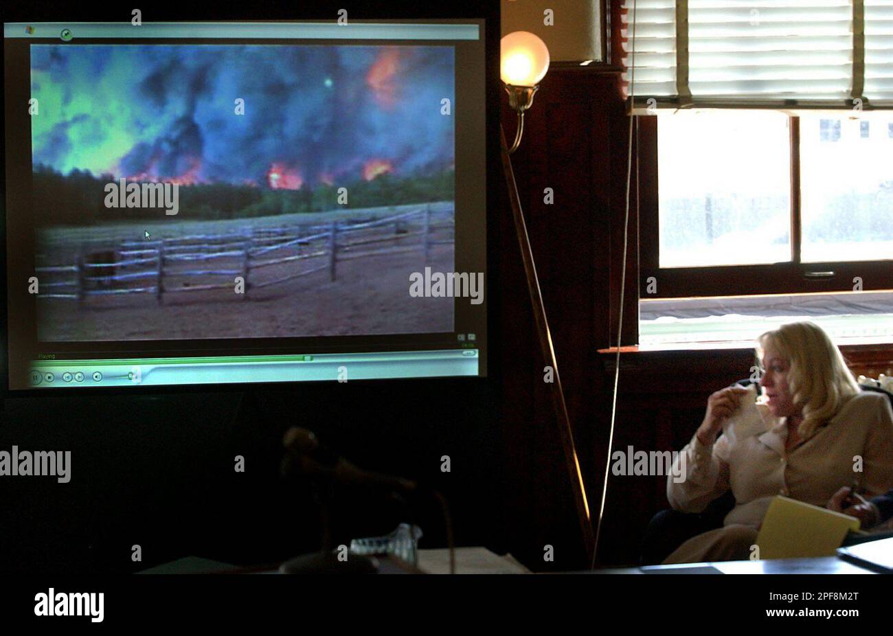 Former U.S. Forest Service employee Terry Lynn Barton, right, reacts ...