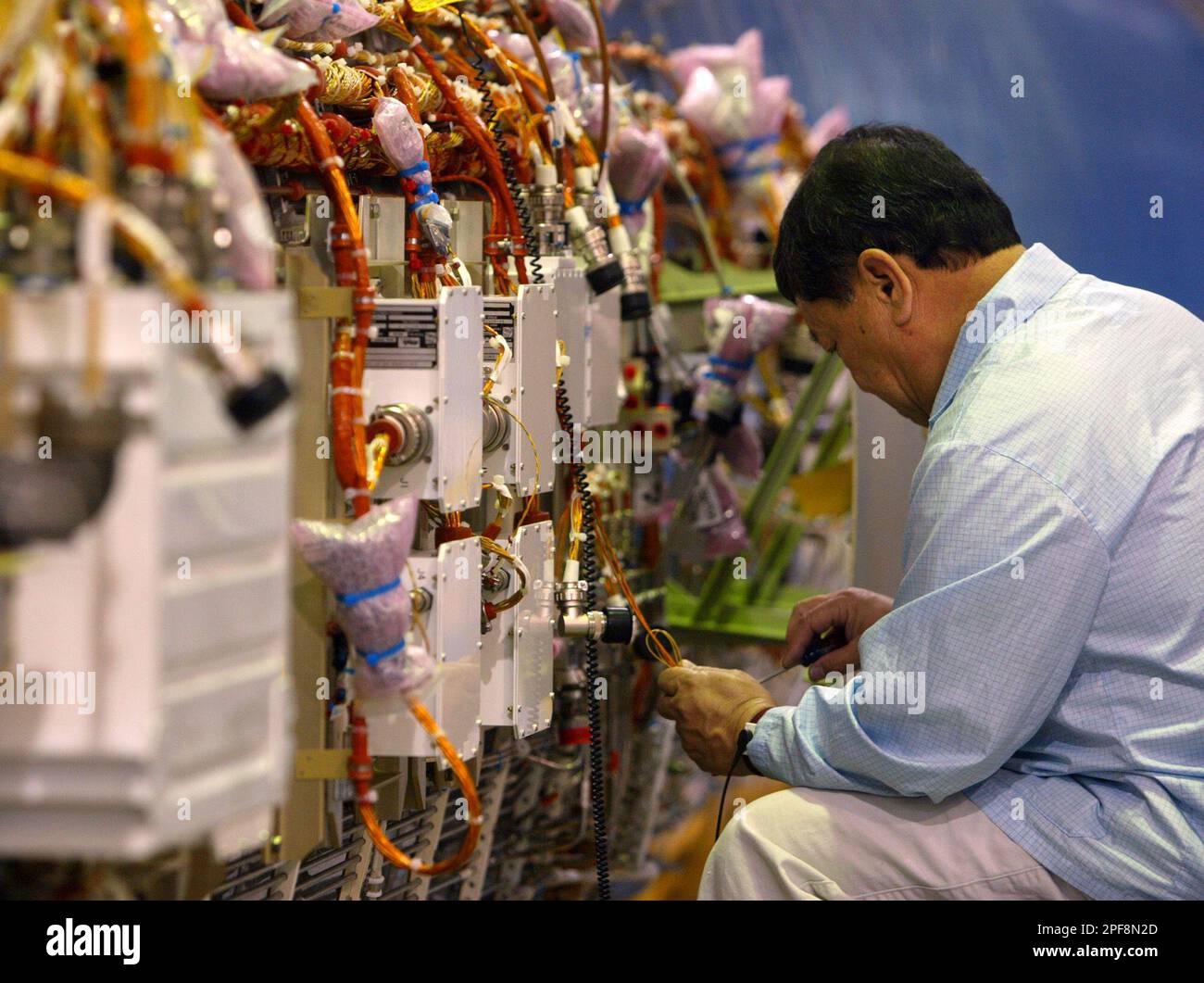 Lockheed Martin electrical harness mechanic Zong Her works on the Atlas ...