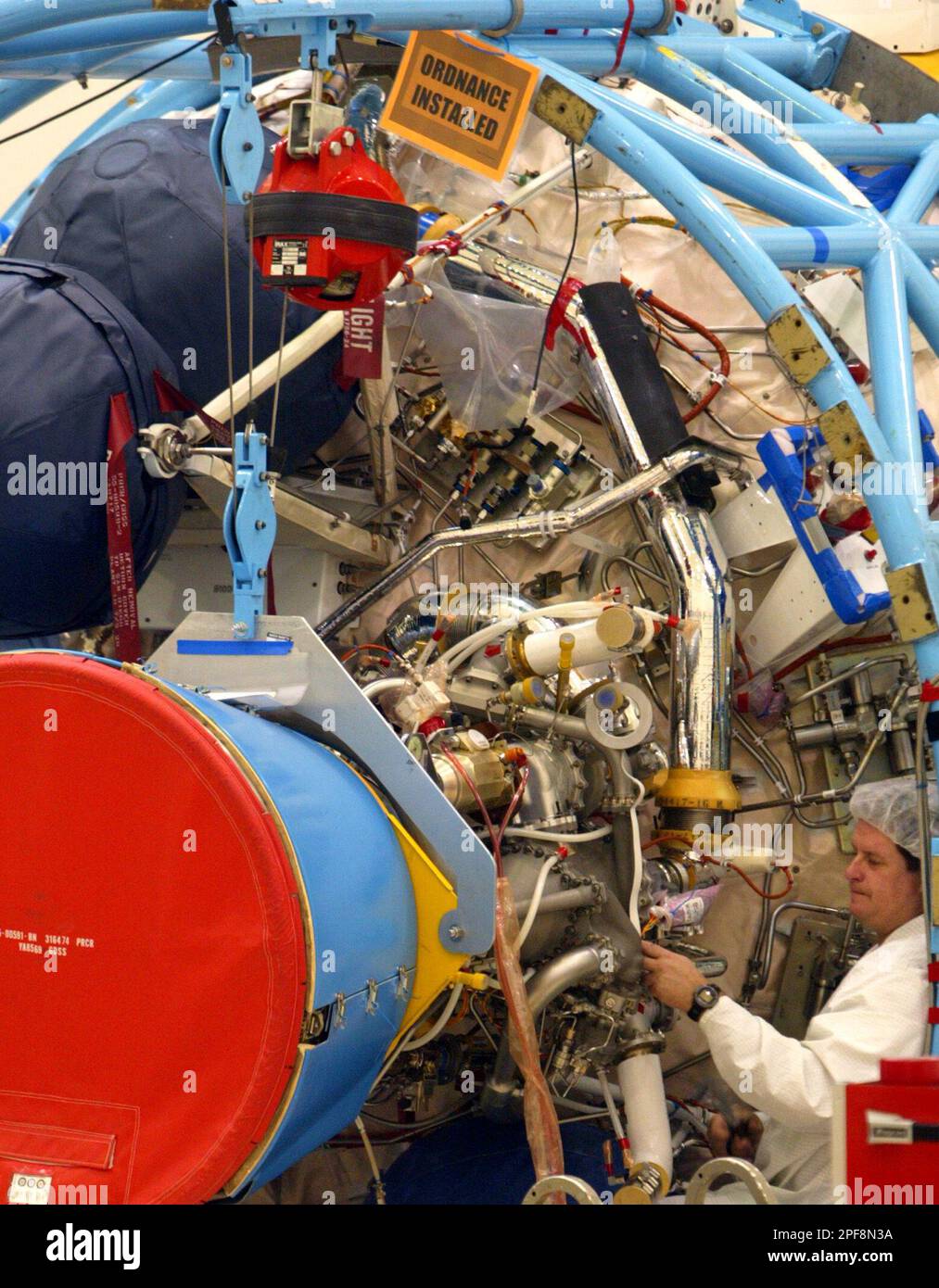 A Lockheed Martin employee works on an Atlas Centaur upperstage launch ...