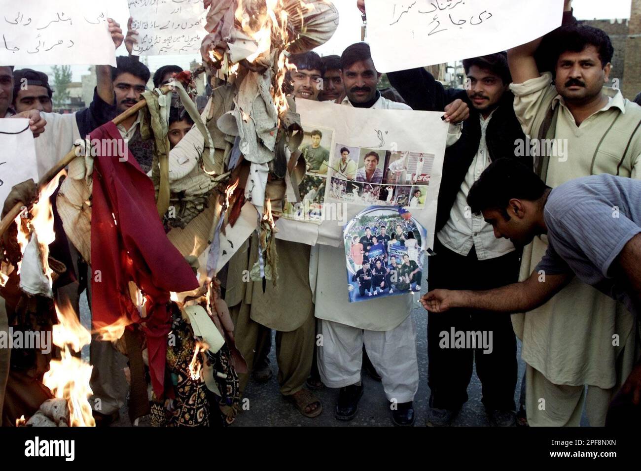 Angry Pakistani cricket fans burn posters of their players to show ...