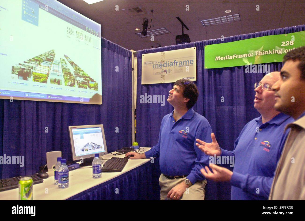 Steven Drucker, left, and Steve DeMar, center, demonstrate MediaFrame ...