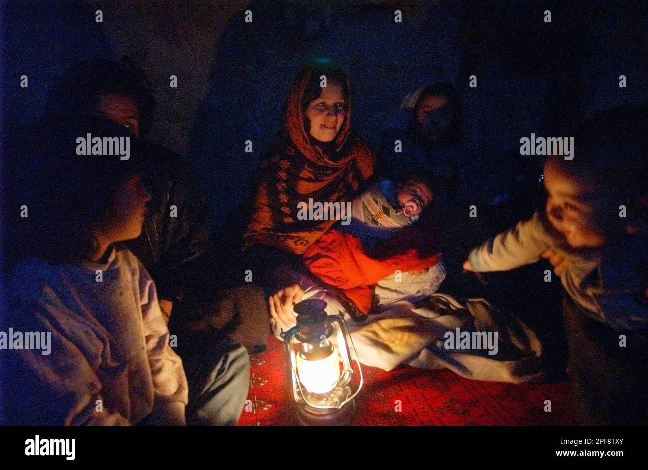 Sharifa, 20, center, holds her two-month-old daughter, Kareshma, as she ...