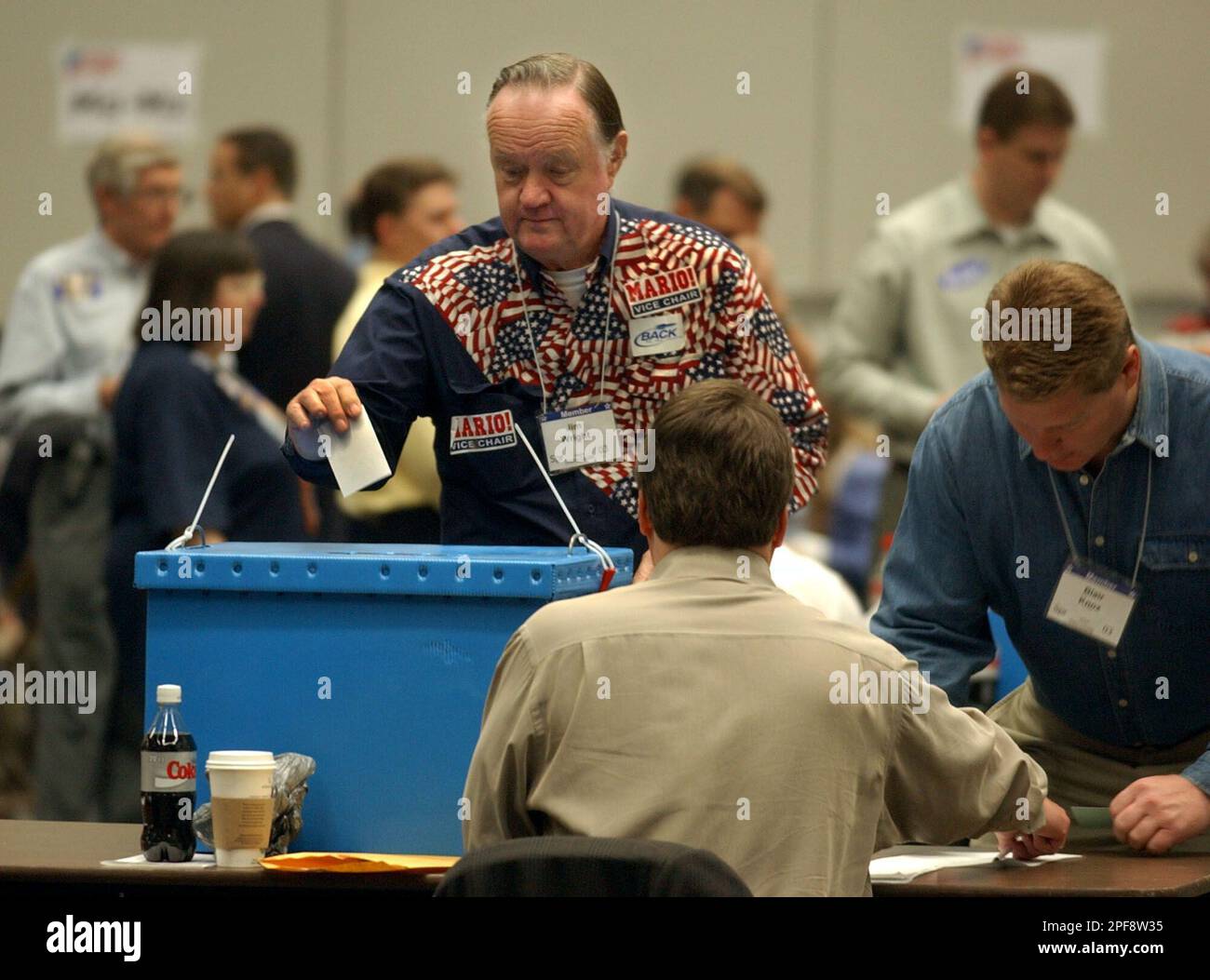 Jim Wright, a delegate from Redding, Calif., casts his ballot for party ...
