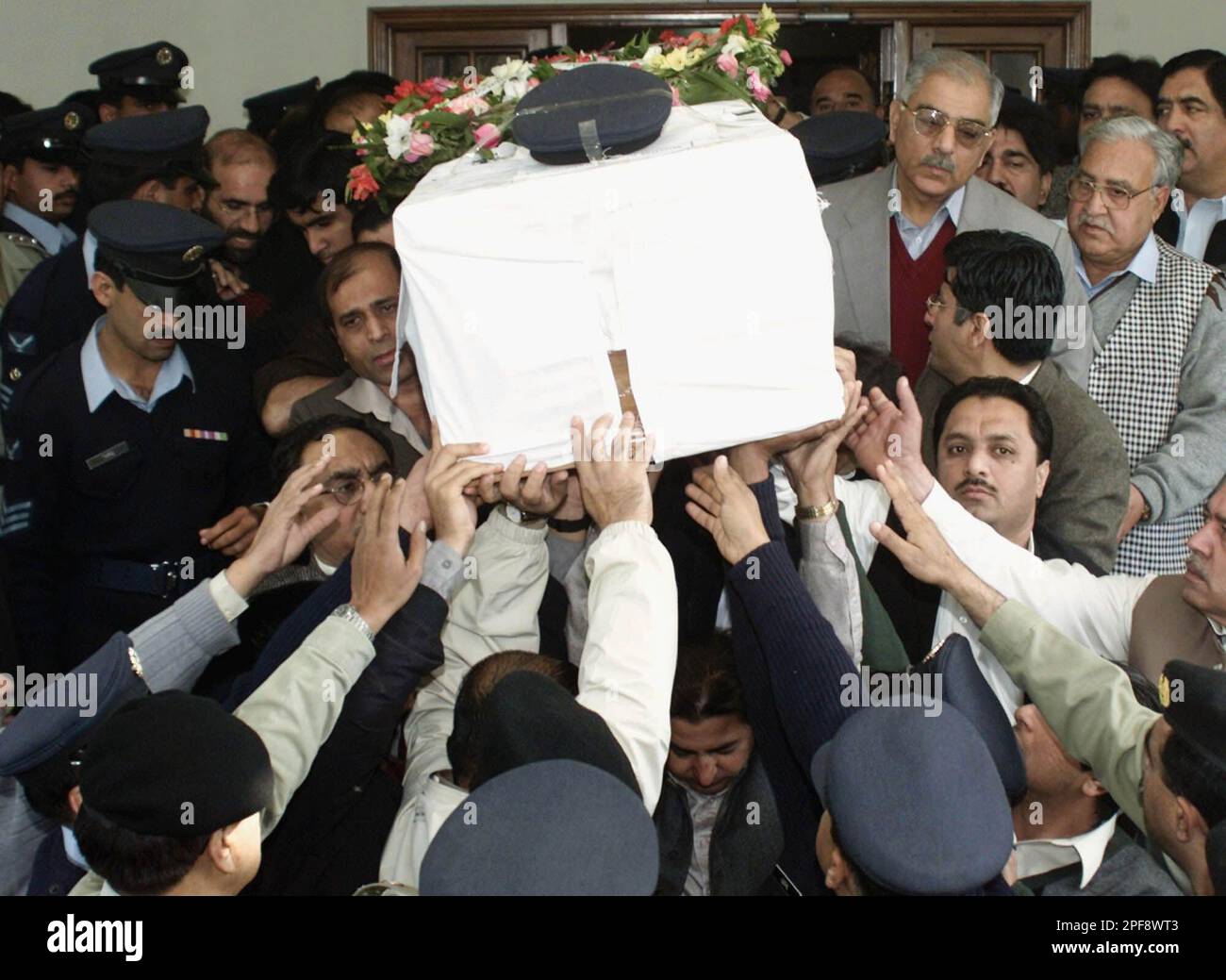 Mourners carry the coffin containing the body of Pakistan air force ...