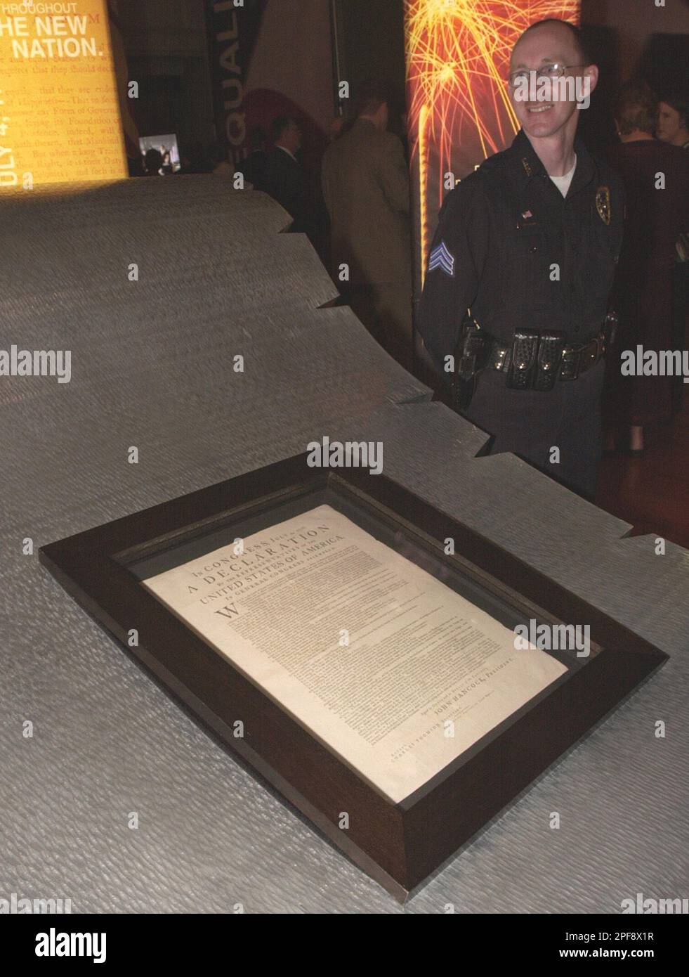 Little Rock police officer Dustin Robertson stands guard next to one of ...