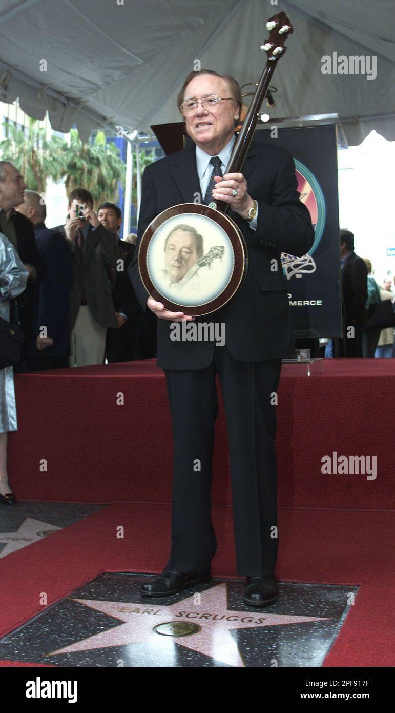 Bluegrass legend Earl Scruggs pauses with a banjo painted with his ...