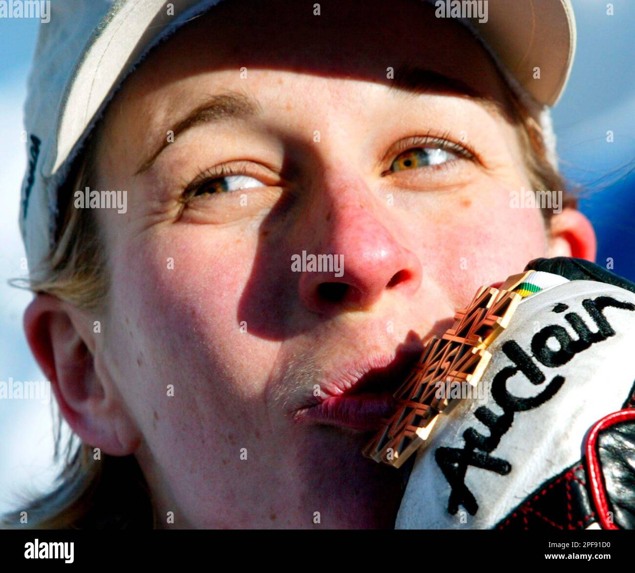 Canadian Allison Forsyth kisses the bronze medal she won in the women's ...
