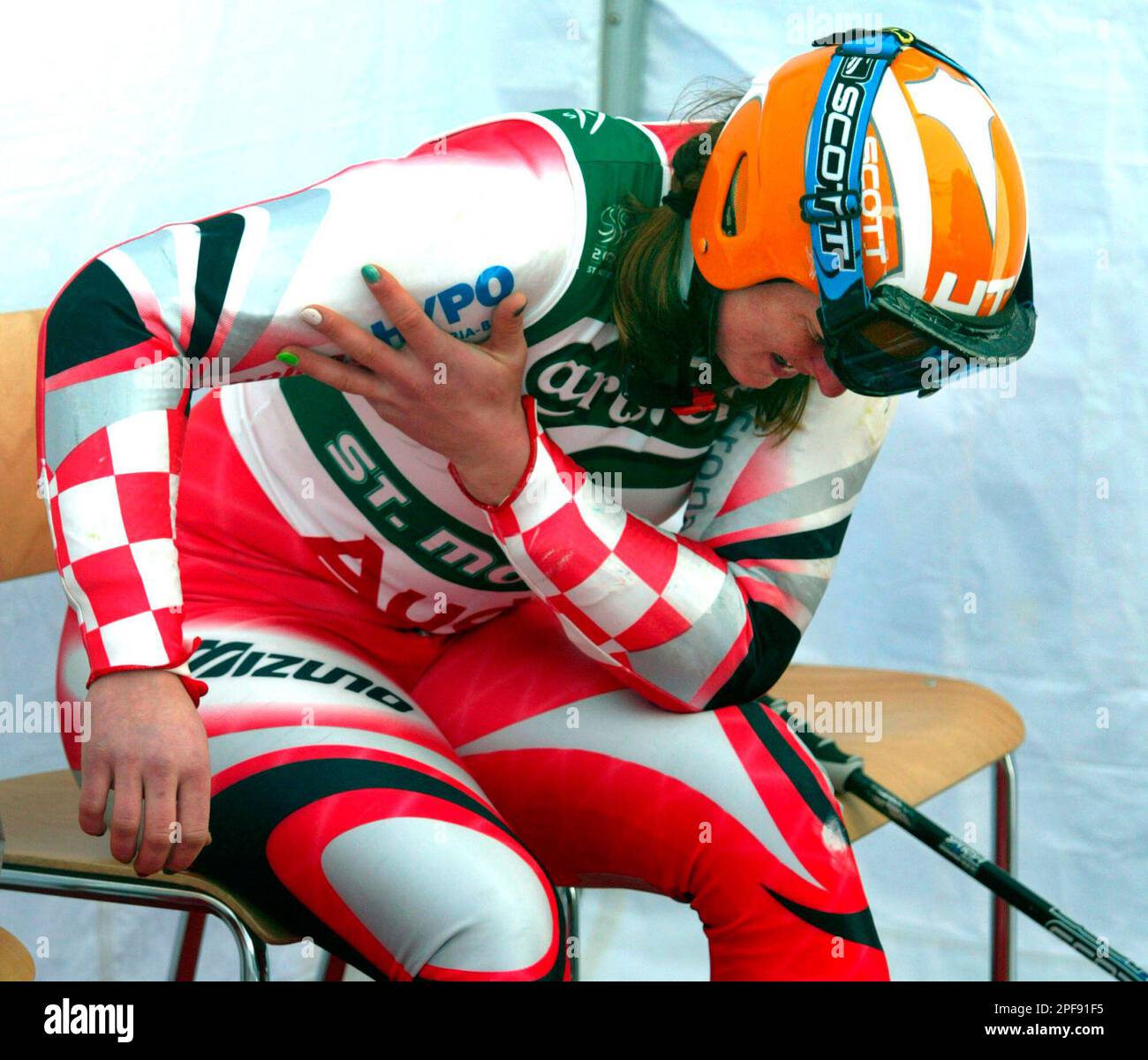 Croatian Janica Kostelic hold her shoulder after finishing 13th in the ...