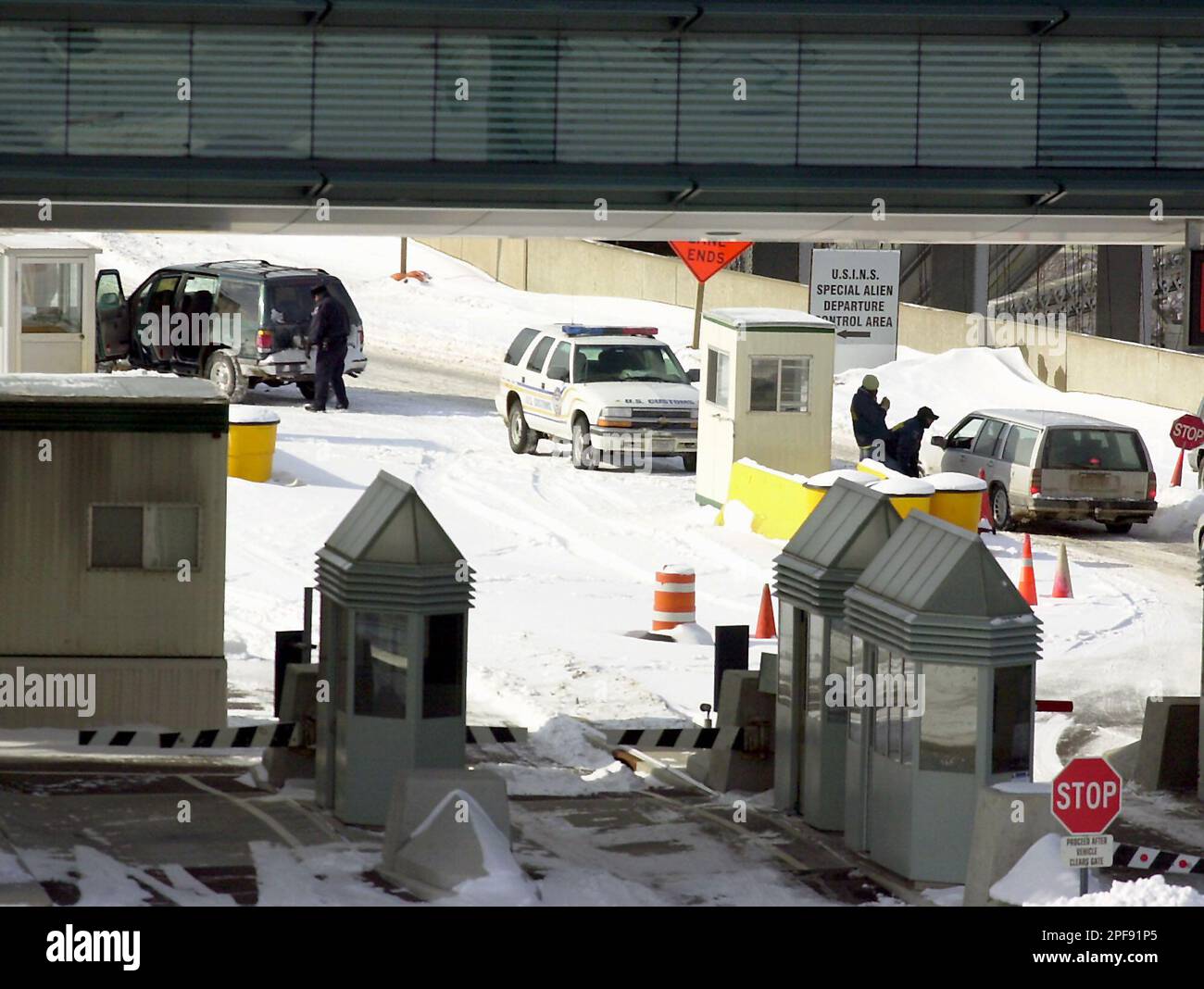 U.S. Customs agents inspect vehicles at the Rainbow Bridge before ...
