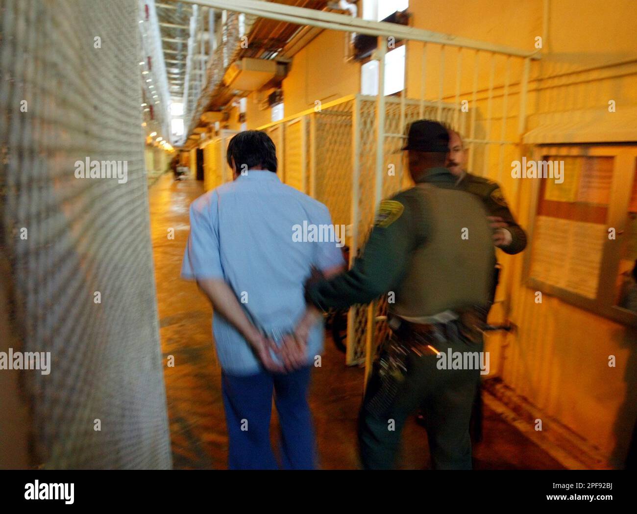 A prisoner on Death Row is led back to his cell in East Block of ...