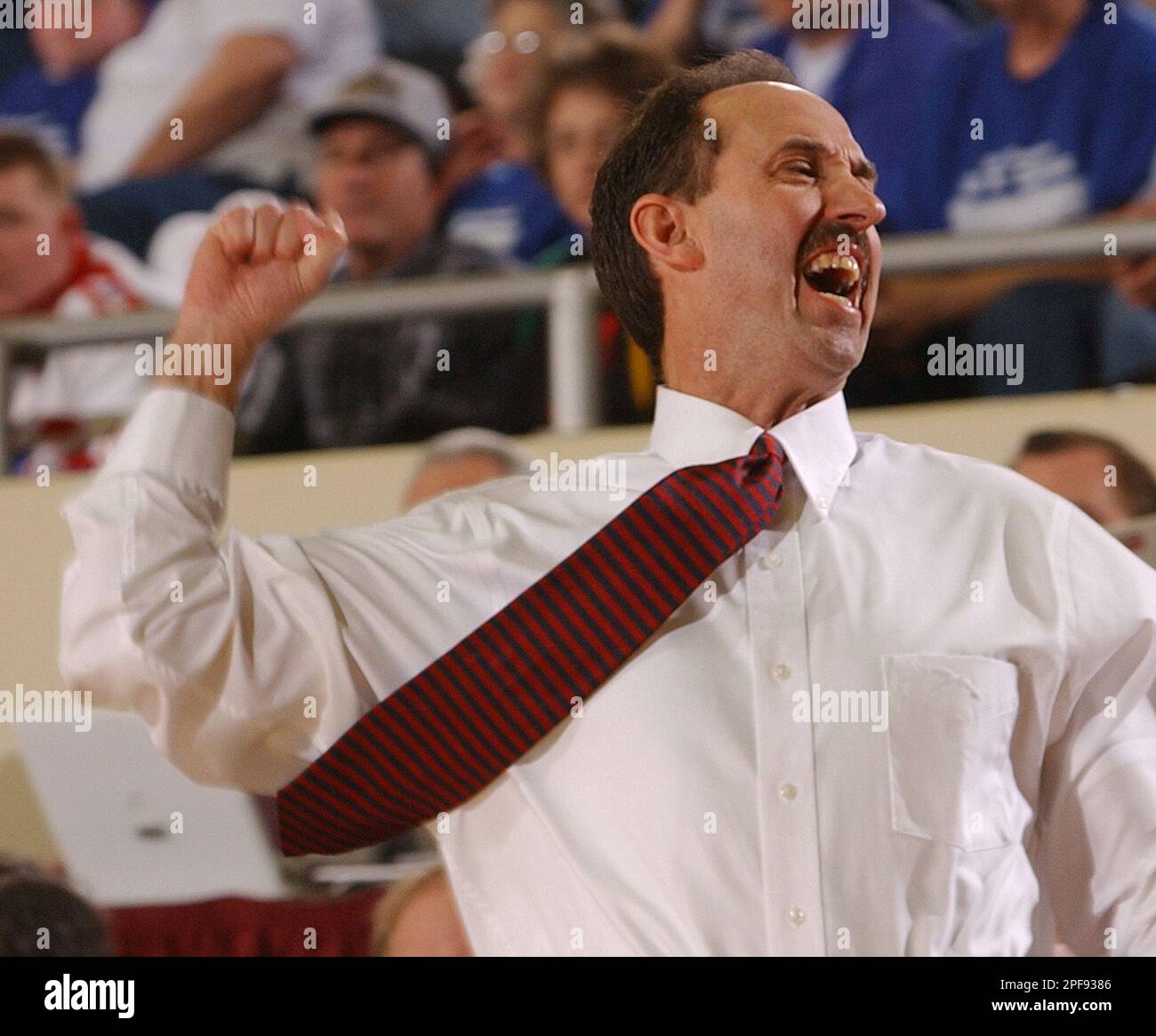 Saint Henry's boys basketball head coach Dave Faust celebrates his team ...
