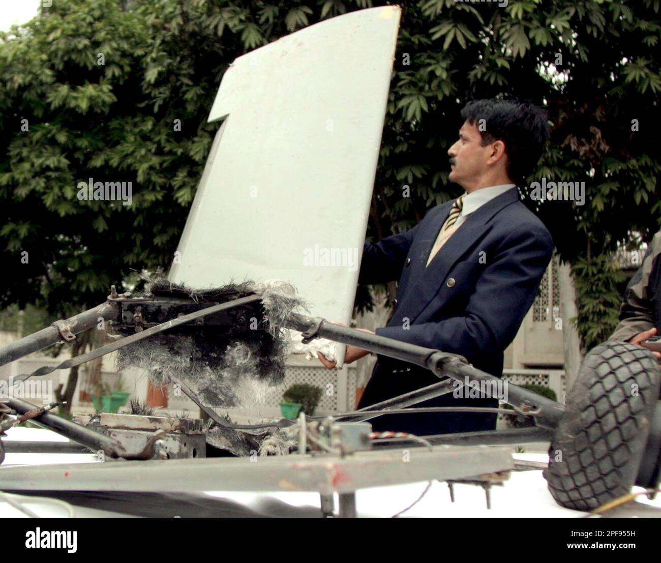 Indian army spokesman Bhanwar Rathore displays the parts of an unmanned ...