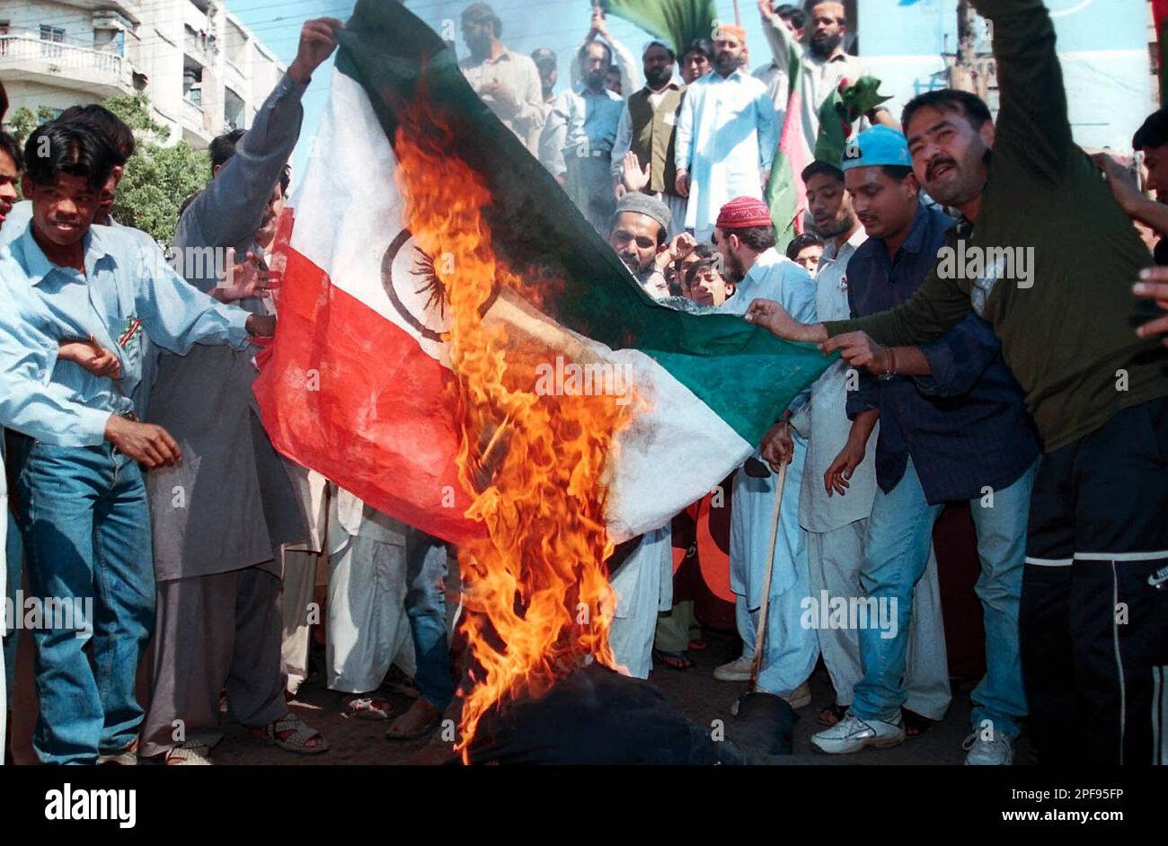 Pakistanis protesters burn Indian Flag in a rally against India on the ...