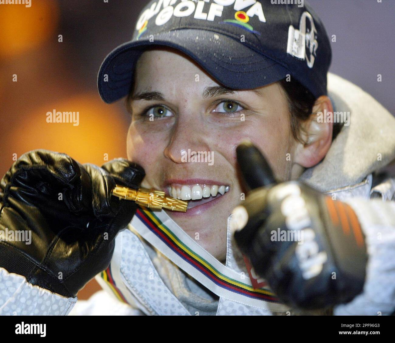 Austrian Michaela Dorfmeister displays the gold medal she won in the ...